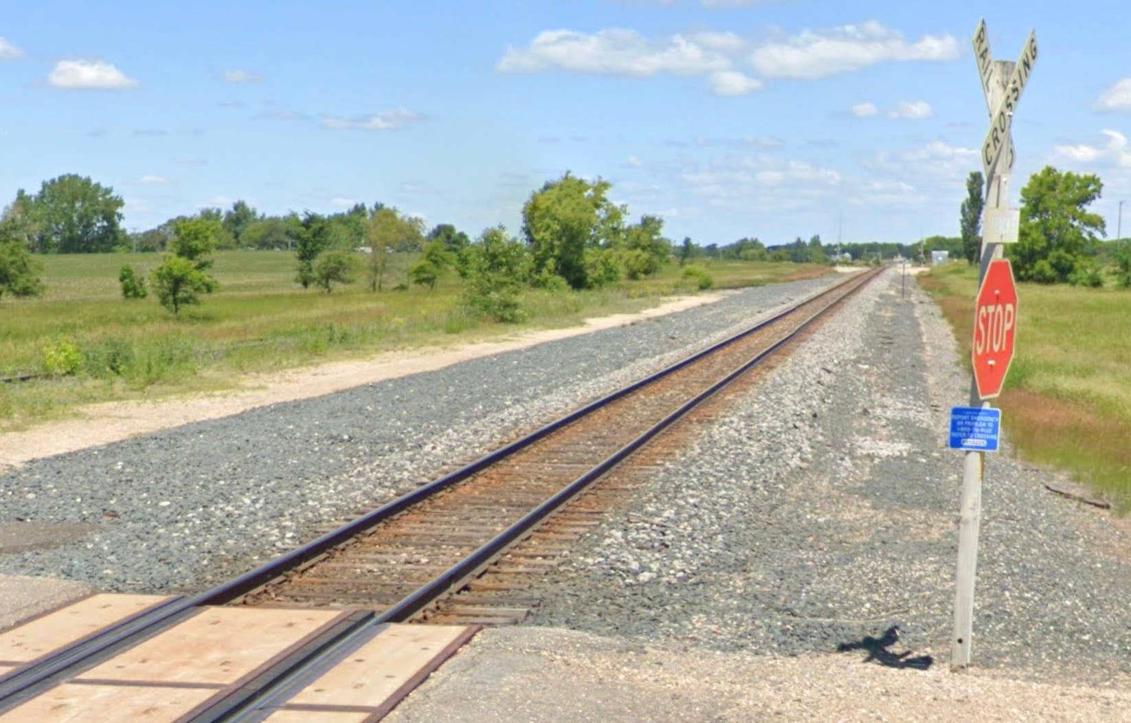 Garbage truck driver severely injured after collision with train ...
