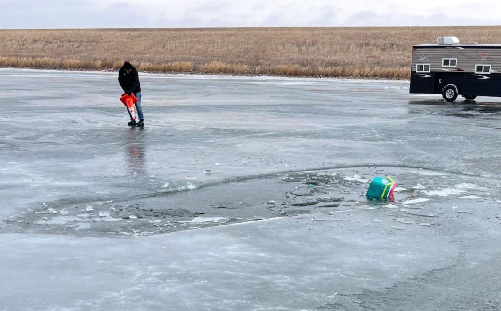 Driver escapes as vehicle plunges through lake ice in southwest ...