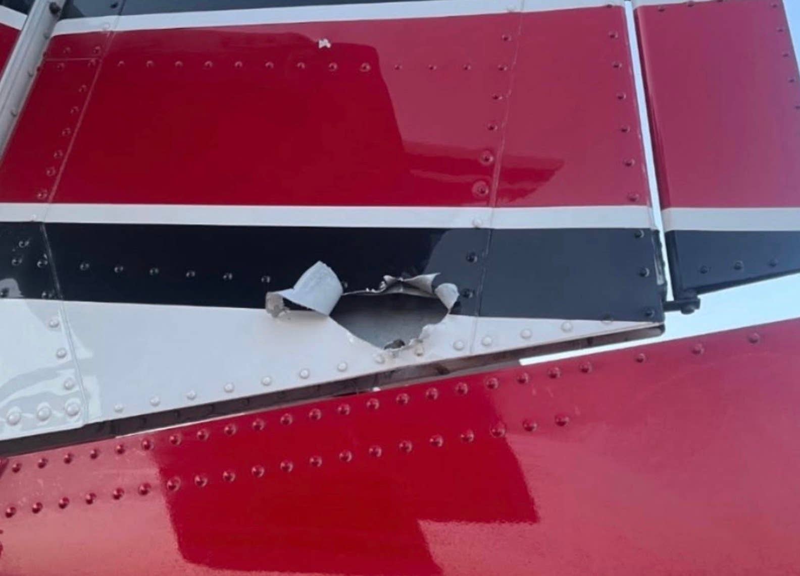 Man arrested after fire suppression plane is struck by gunfire - Bring ...