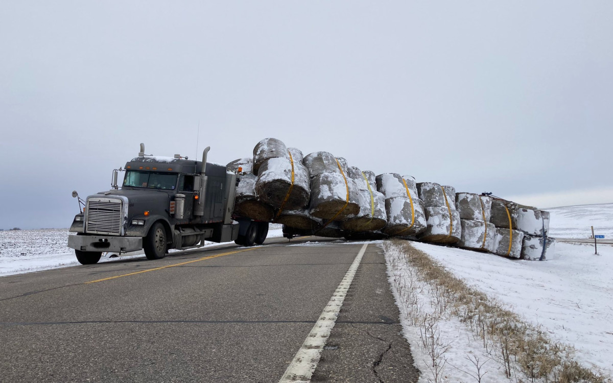 Photos: Semi hauling dozens of hay bales tips, blocking highway - Bring ...