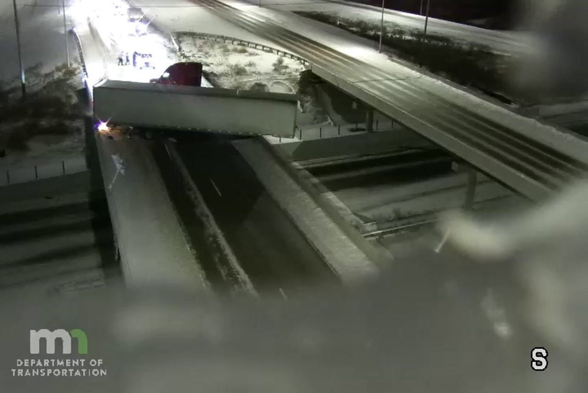 Semi-trailer jackknifes on bridge, hangs over I-694 - Bring Me The News