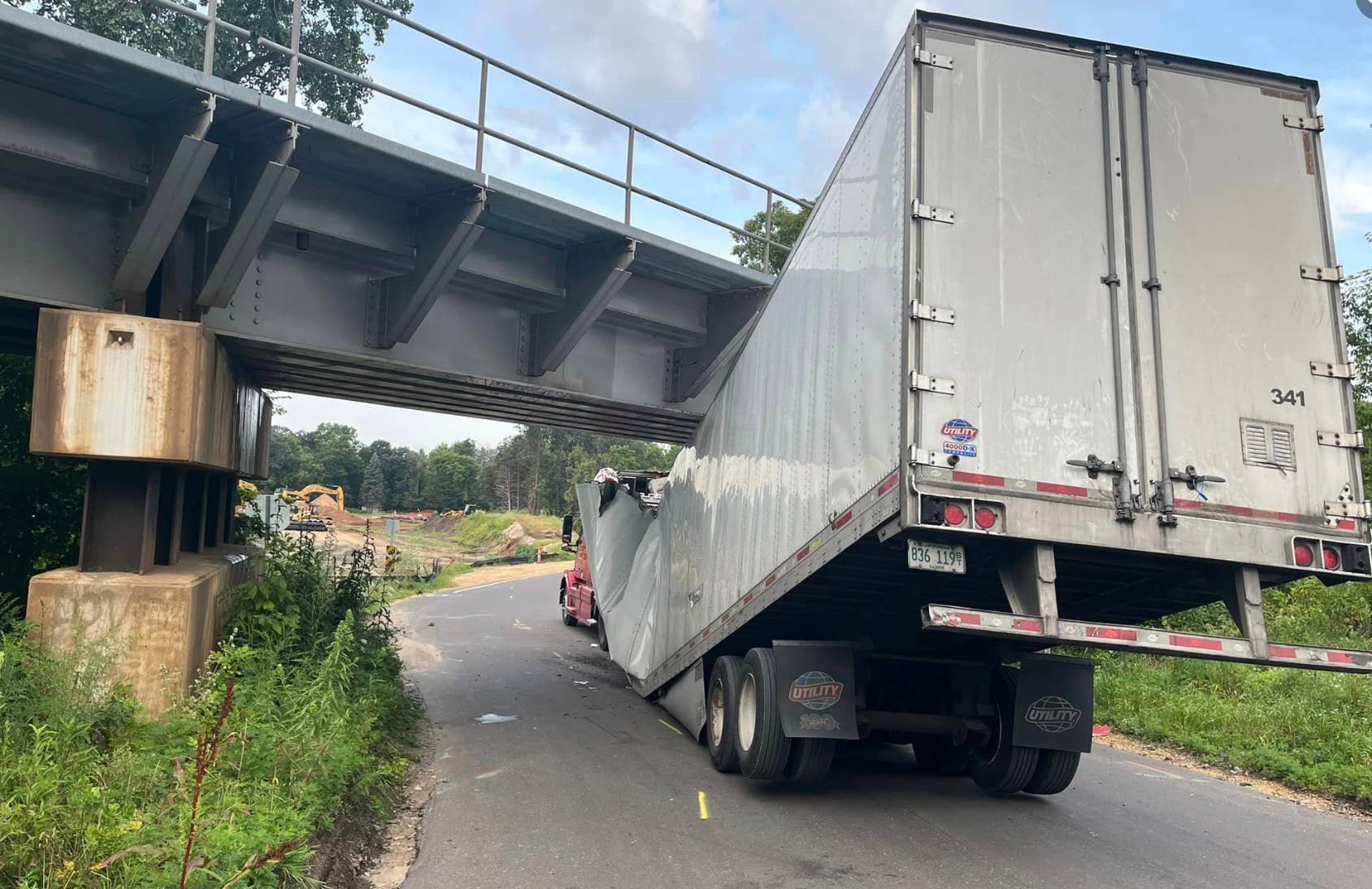 Semi-trailer hits underside of railroad bridge in Cottage Grove - Bring ...