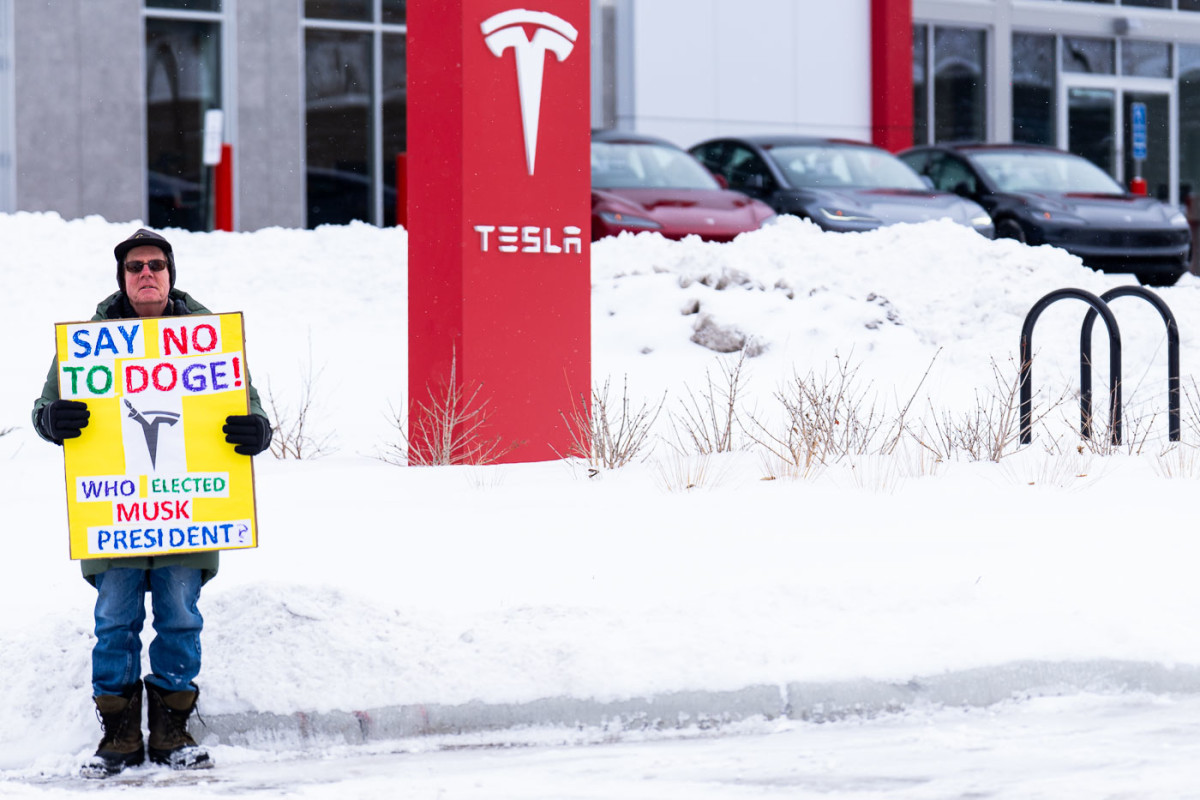 A protest against Elon Musk outside a Twin Cities Tesla showroom is ...